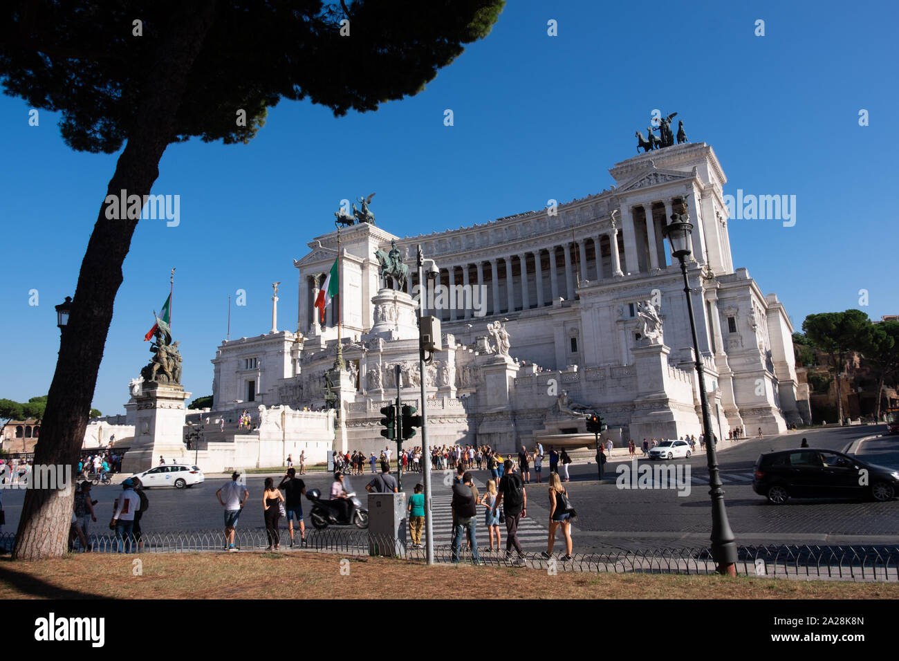 Wonderful statuary and flying Italian flags on the huge grand marble ...