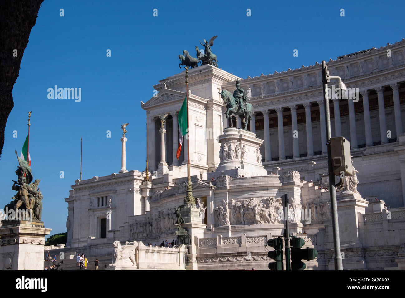 Wonderful statuary and flying Italian flags on the huge grand marble ...