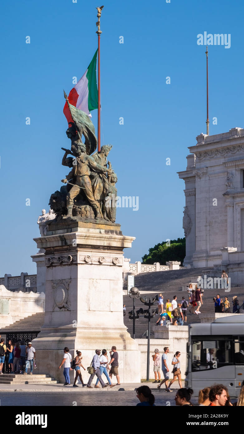 Wonderful statuary and flying Italian flags on the huge grand marble ...