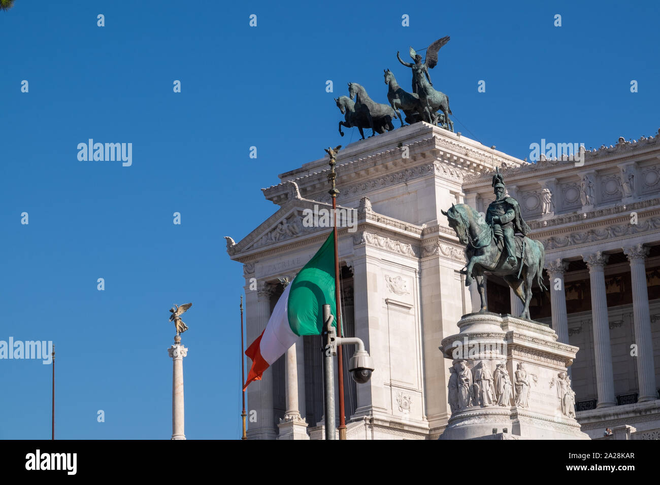 Wonderful statuary and flying Italian flags on the huge grand marble ...