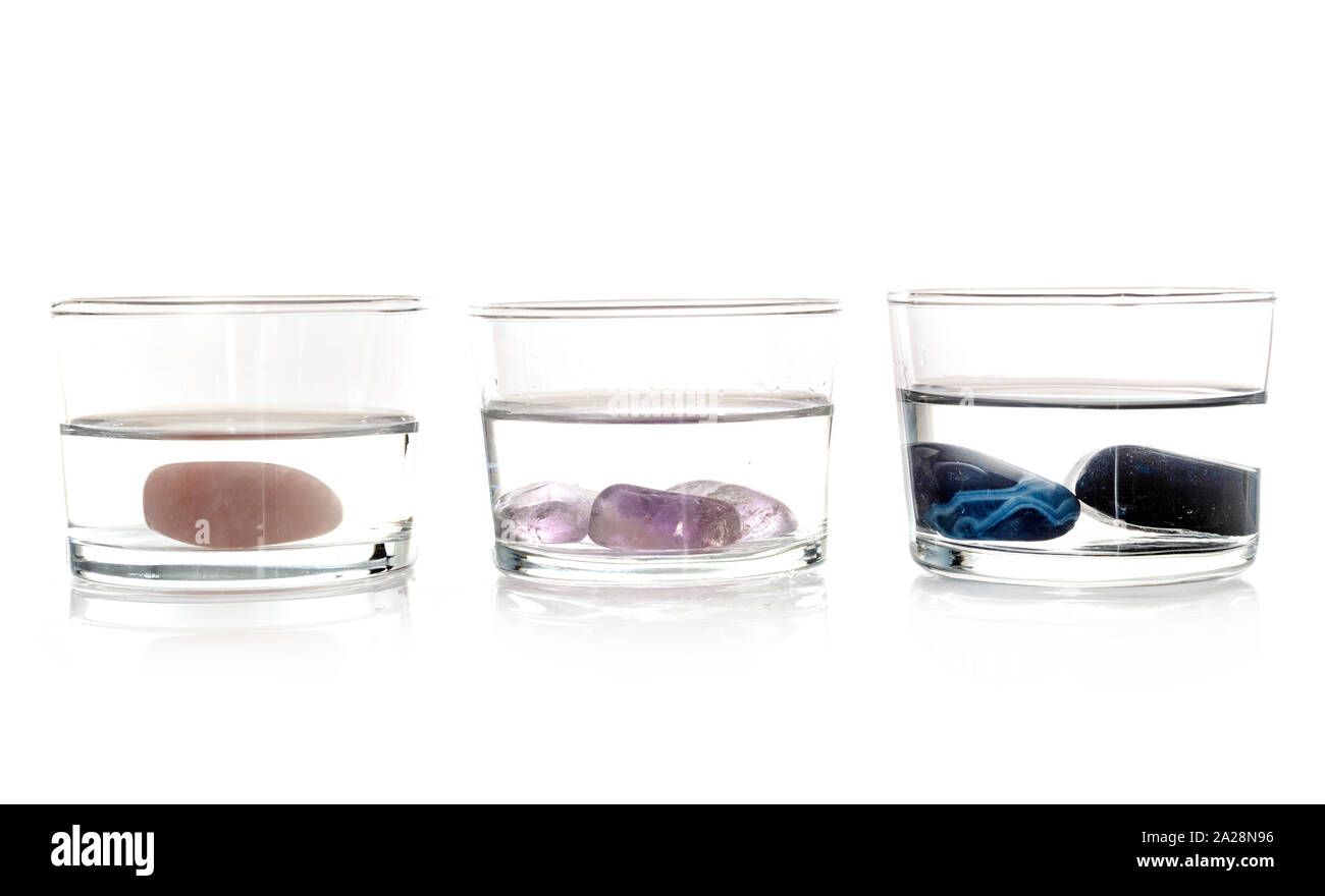 gems in glasses in front of white background Stock Photo - Alamy