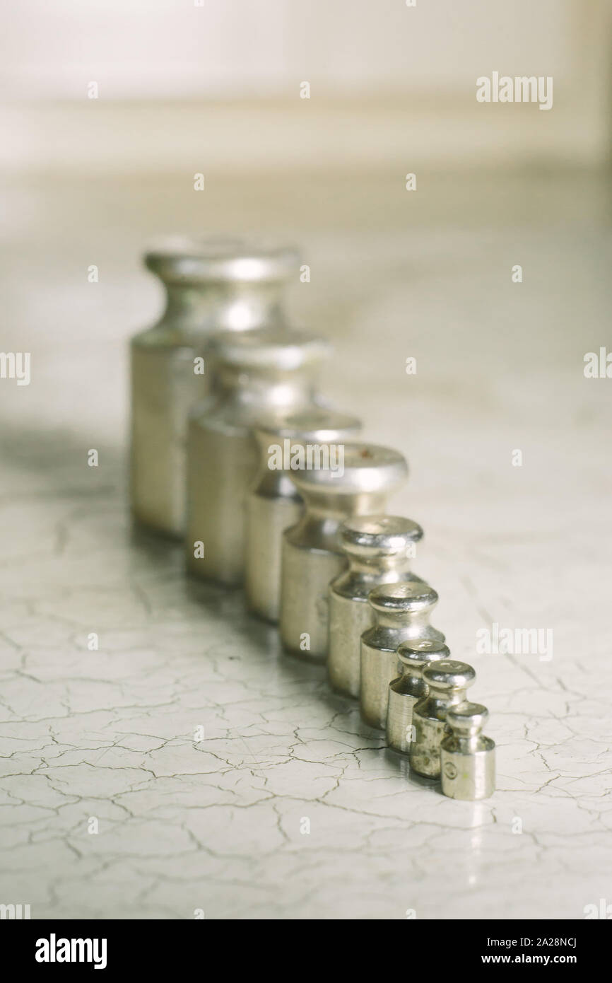 Set of pharmacy laboratory precision weights for a balance scale on an ...