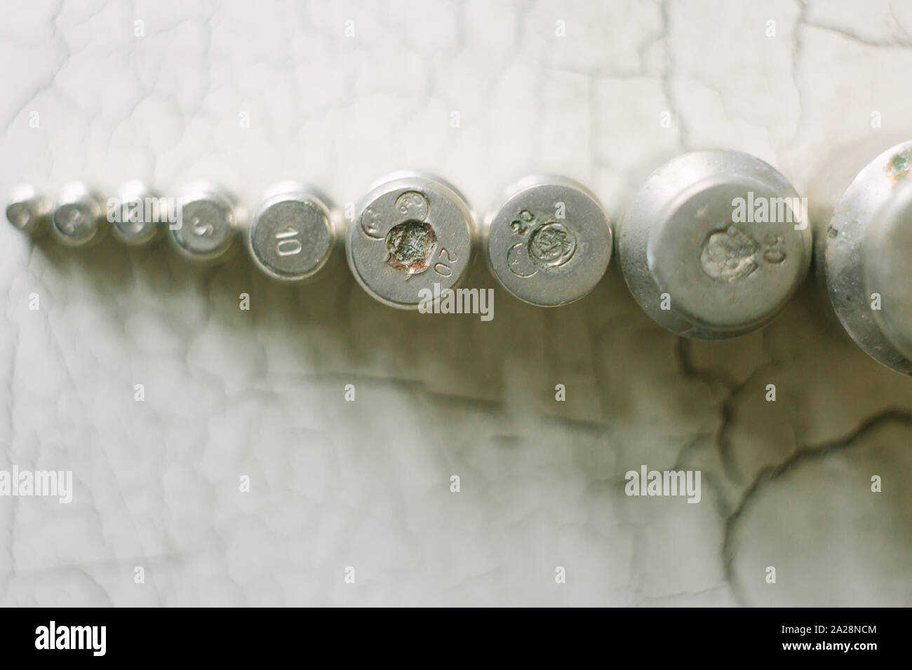 Set of pharmacy laboratory precision weights for a balance scale on an ...