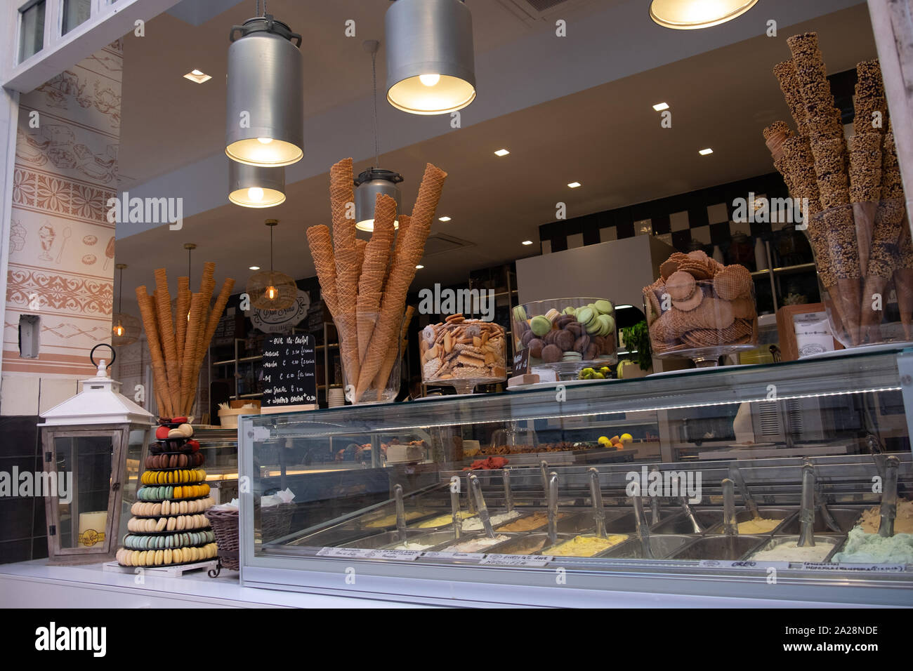 Streetside attractive window display of enticing ice creams, cones and ...