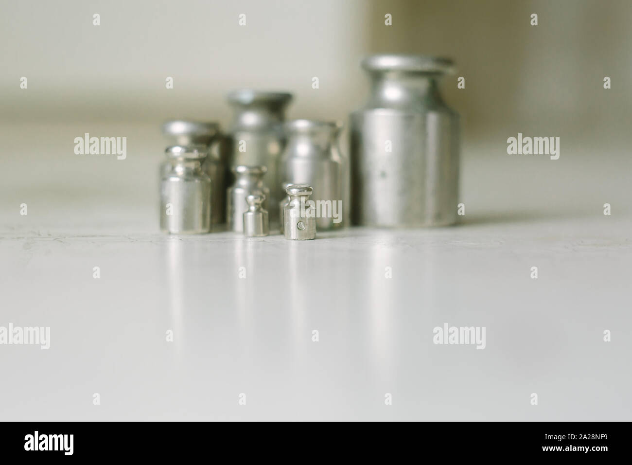 Set of pharmacy laboratory precision weights for a balance scale on an ...