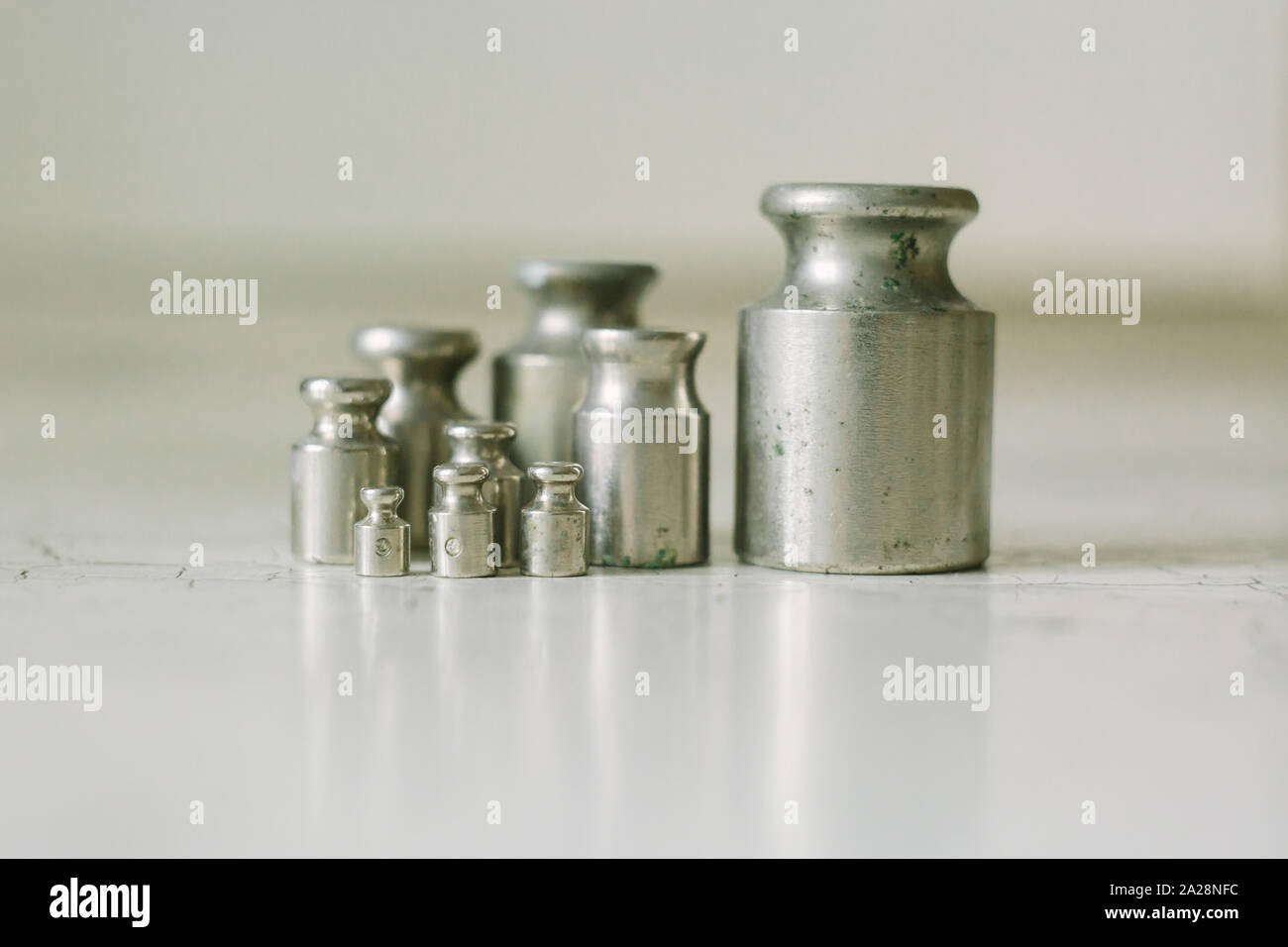 Set of pharmacy laboratory precision weights for a balance scale on an ...