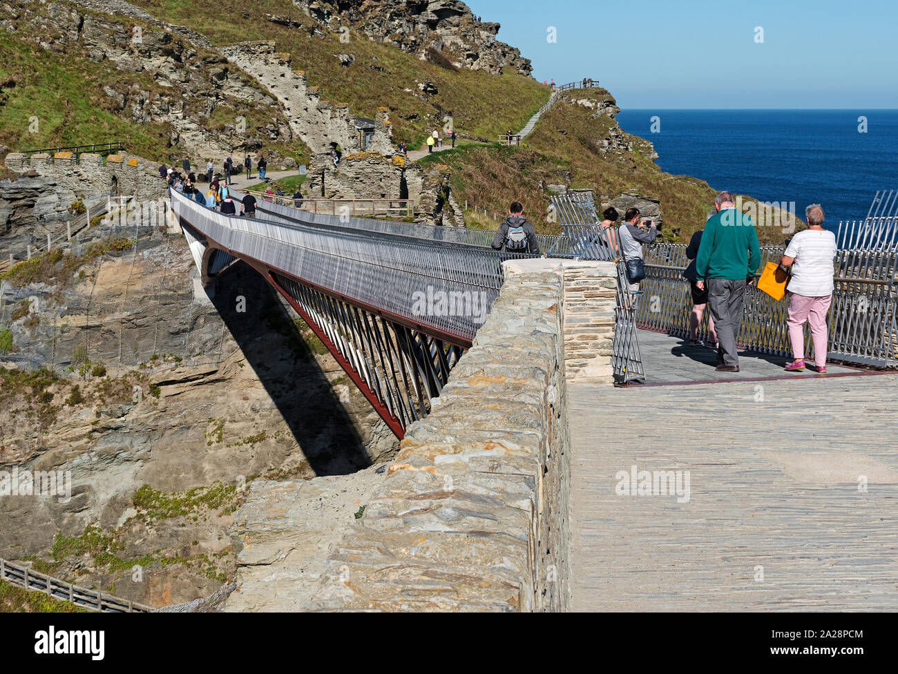 visitors walking over the new 70 metre cantilever bridge at tintagel ...