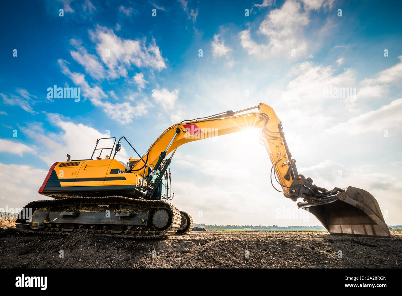 Big excavator in construction site Stock Photo - Alamy