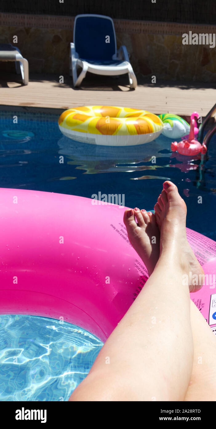 woman relaxing on a pool Stock Photo - Alamy