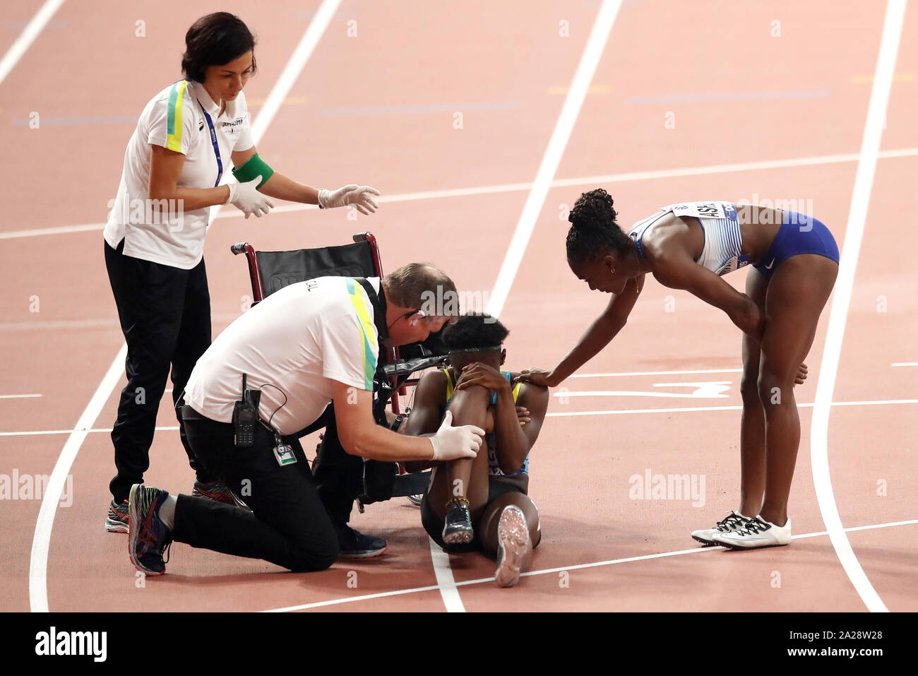 The Bahamas' Anthonique Strachan (left) is comforted by Great Britain's ...