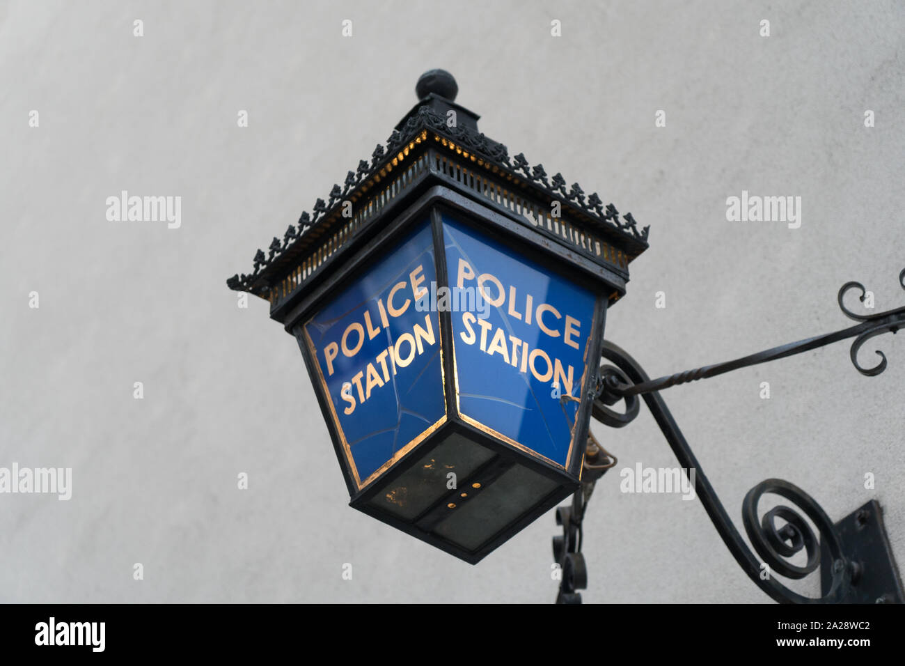 An old-fashioned blue police lamp at Shepherds Bush police station in ...