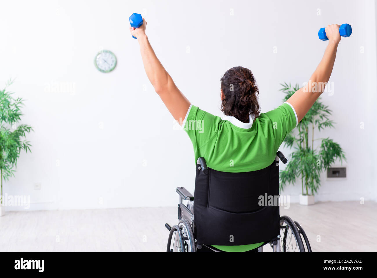 Wheelchair man lifting weight in hi-res stock photography and images ...