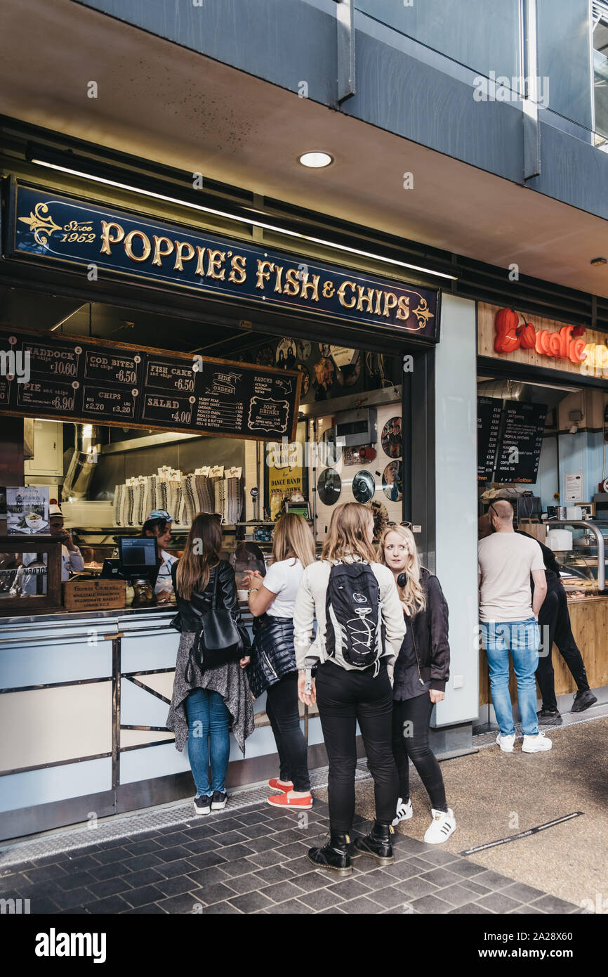 London, UK - September 07, 2019: People ordering from Poppies fish and ...