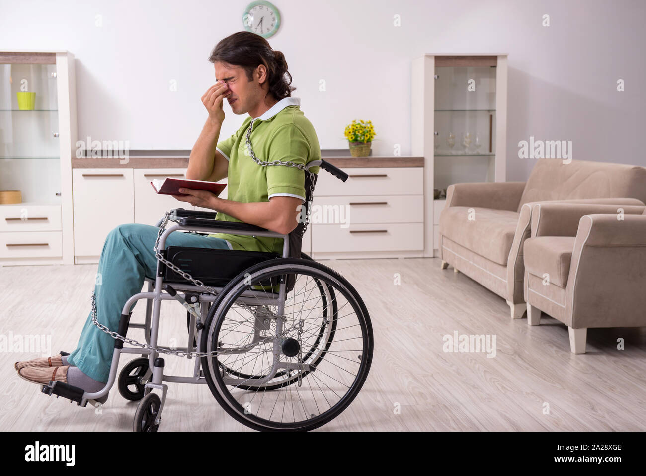 Restrained wheelchair hi-res stock photography and images - Alamy