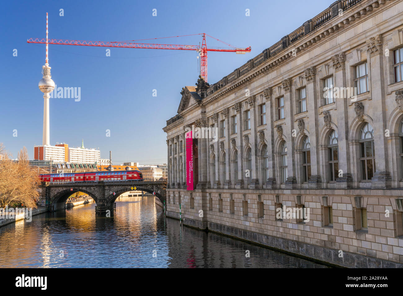 TRAIN CROSSING BRIDGE BY THE BODE MUSEUM ONTO MUSEUM ISLAND, BERLIN ...