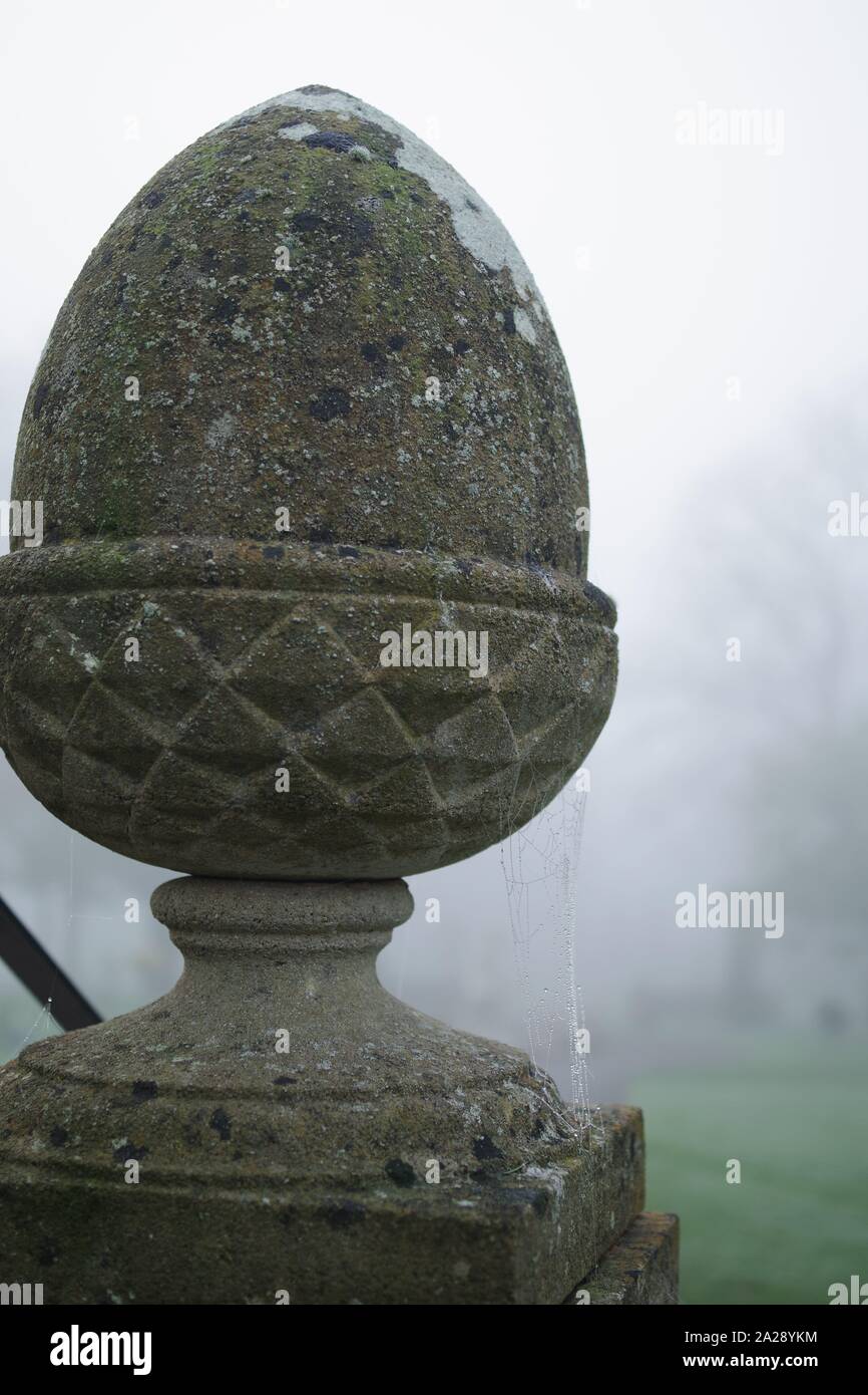Carved Stone Acorn Garden Ornament, Covered in Lichen on a Winters Day ...