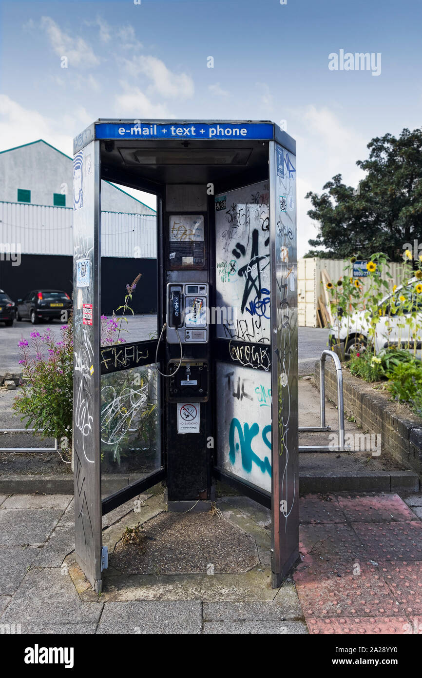 UK Phone box vandalised with graffiti Stock Photo - Alamy
