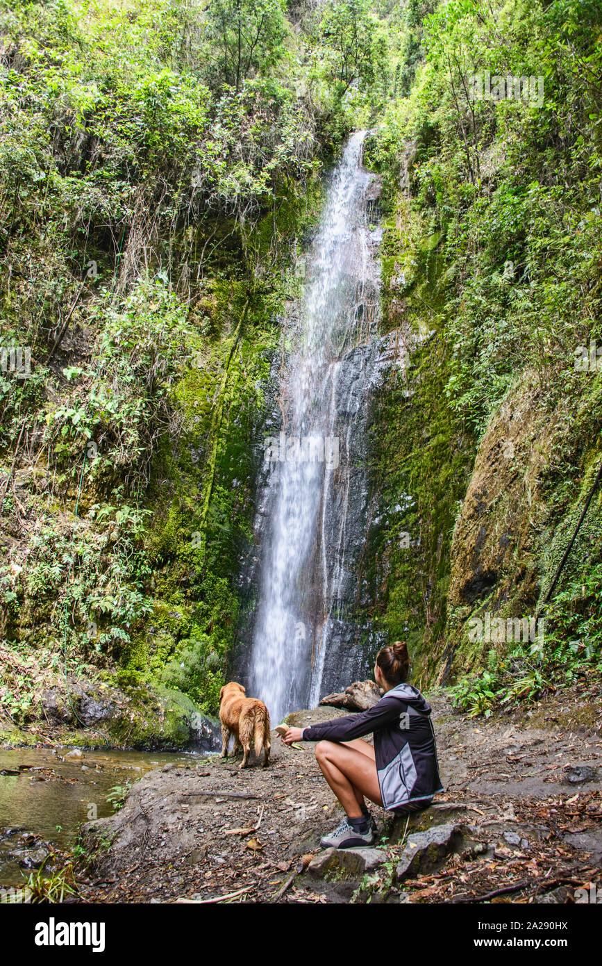Tourist at the beautiful waterfall in Vilcabamba, Ecuador Stock Photo ...