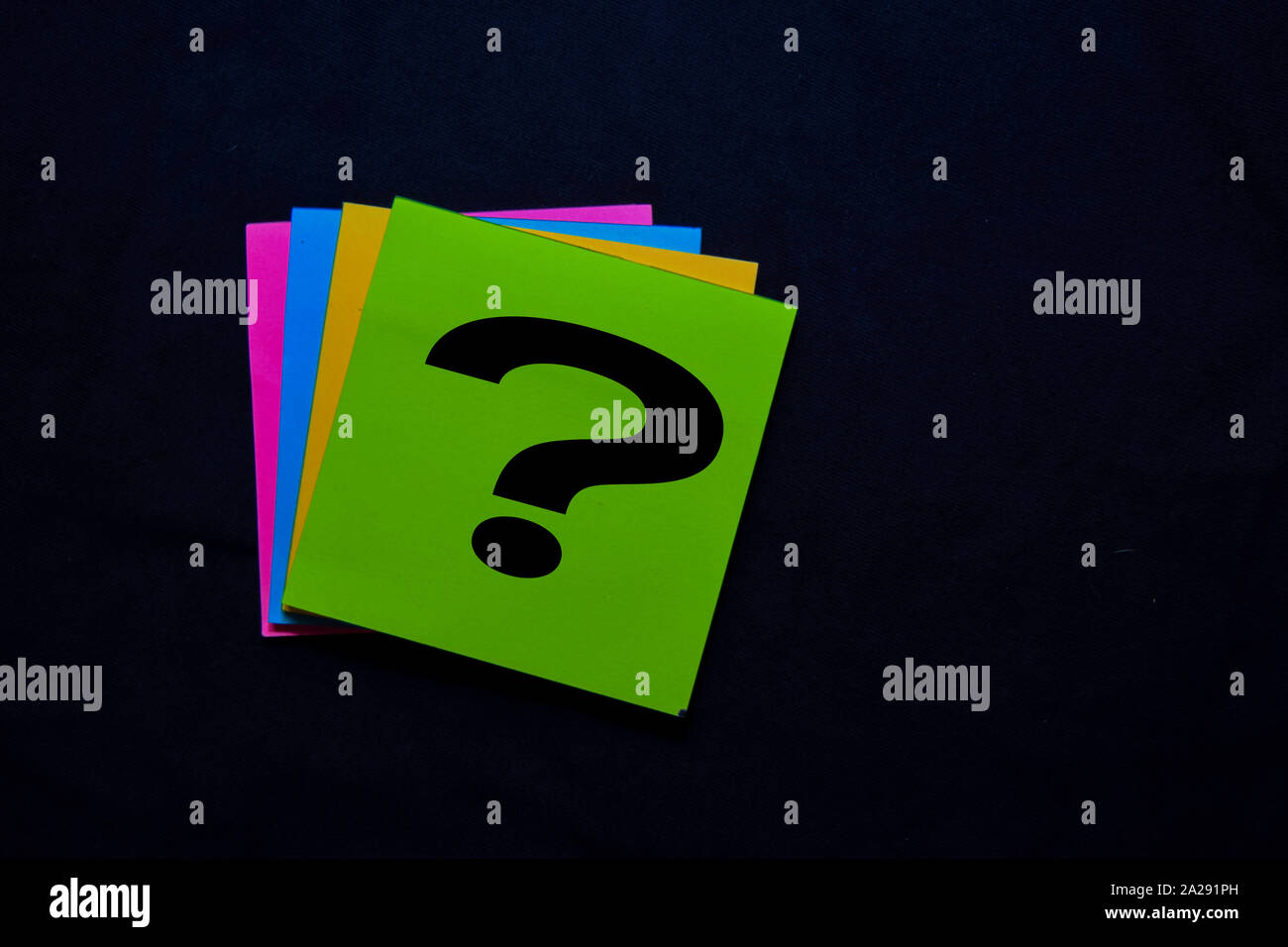 Question mark on sticky notes isolated on black background Stock Photo ...