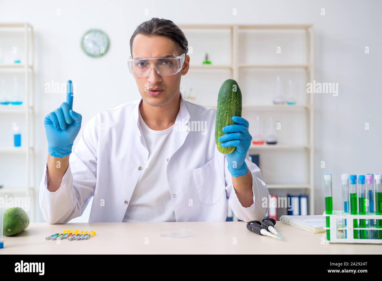 The male nutrition expert testing vegetables in lab Stock Photo - Alamy
