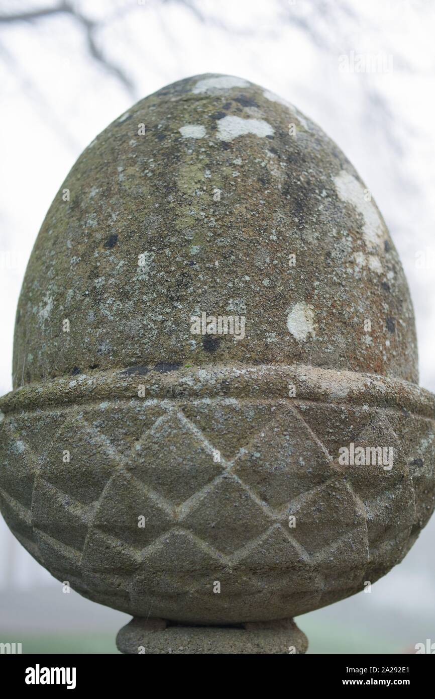 Carved Stone Acorn Garden Ornament, Covered in Lichen on a Winters Day ...