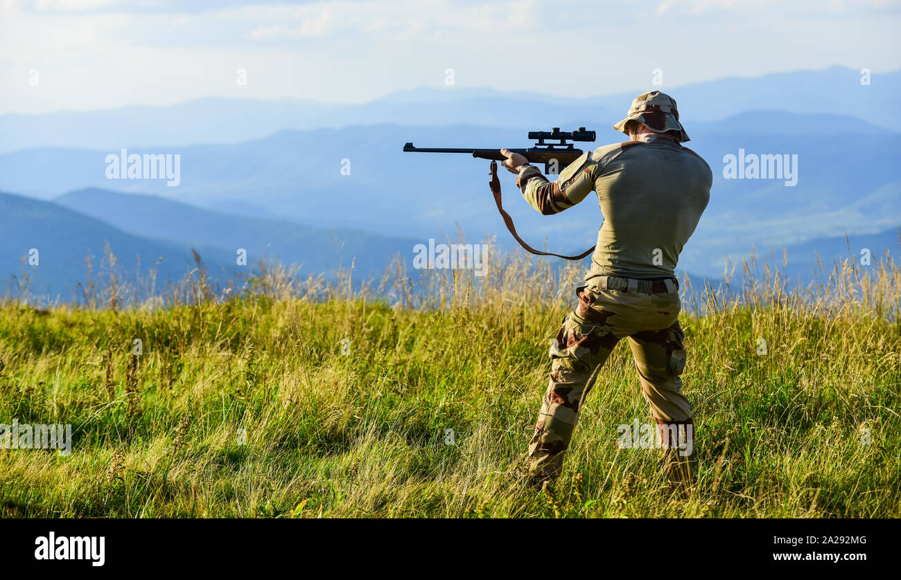 Military Operation in Action. hunter in camouflage. security of ...