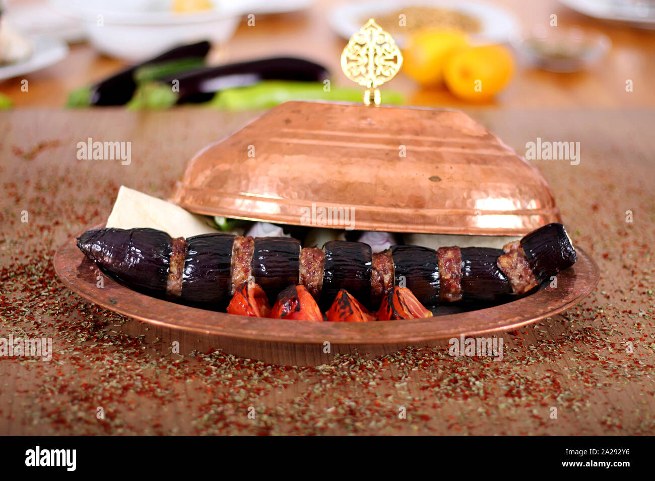Roast meat and eggplant in copper dish Stock Photo - Alamy
