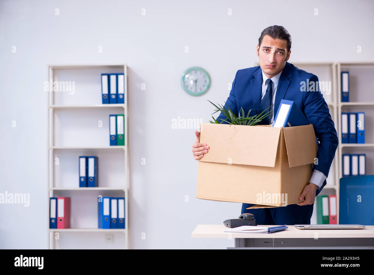 The young employee being made redundant Stock Photo - Alamy