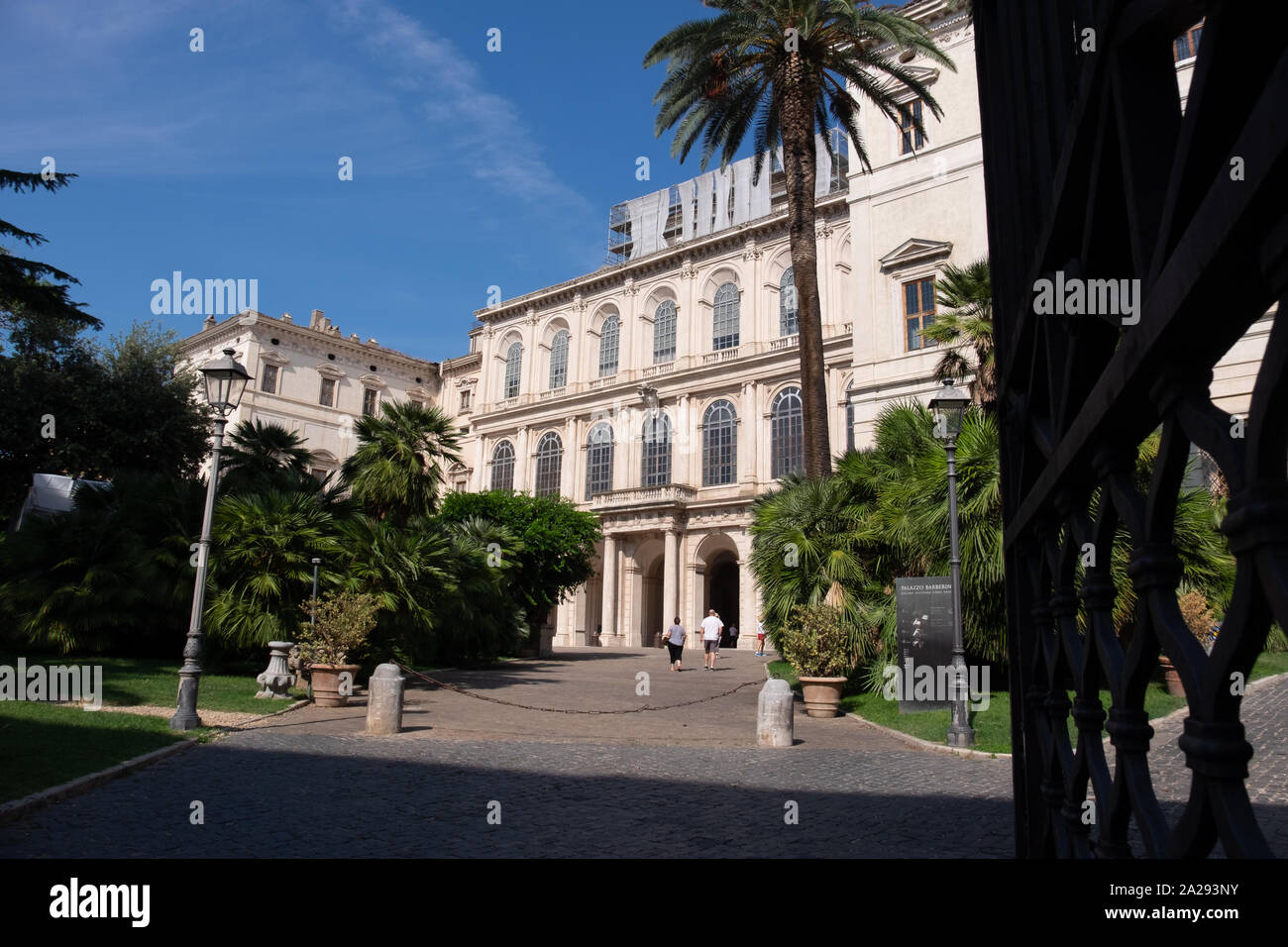 Imposing, four storey white Italianate building of arched windows and ...