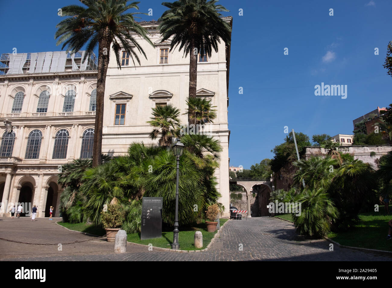 Imposing, four storey white Italianate building of arched windows and ...