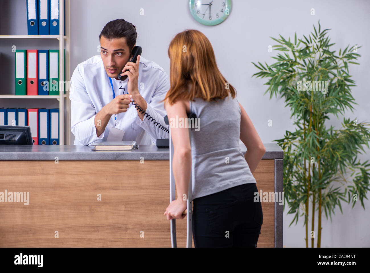The young patient at the reception in the hospital Stock Photo - Alamy