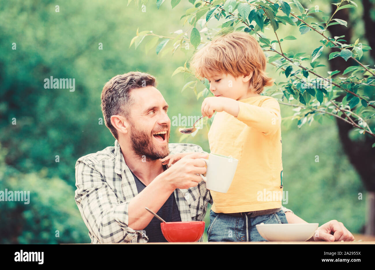 Feeding baby. Menu for children. Family enjoy homemade meal. Father son ...