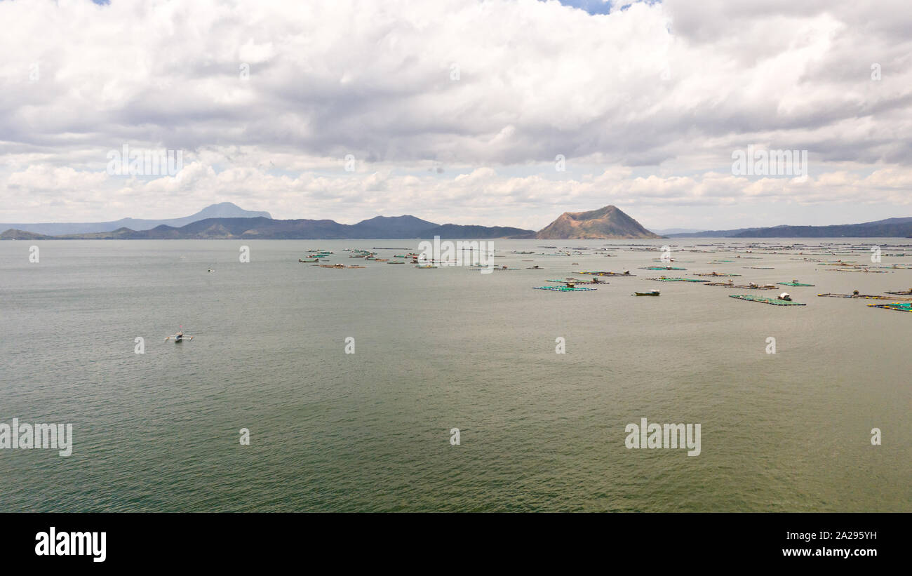 Lake Taal with a volcano and fish cages on a fish farm, top view. Luzon ...