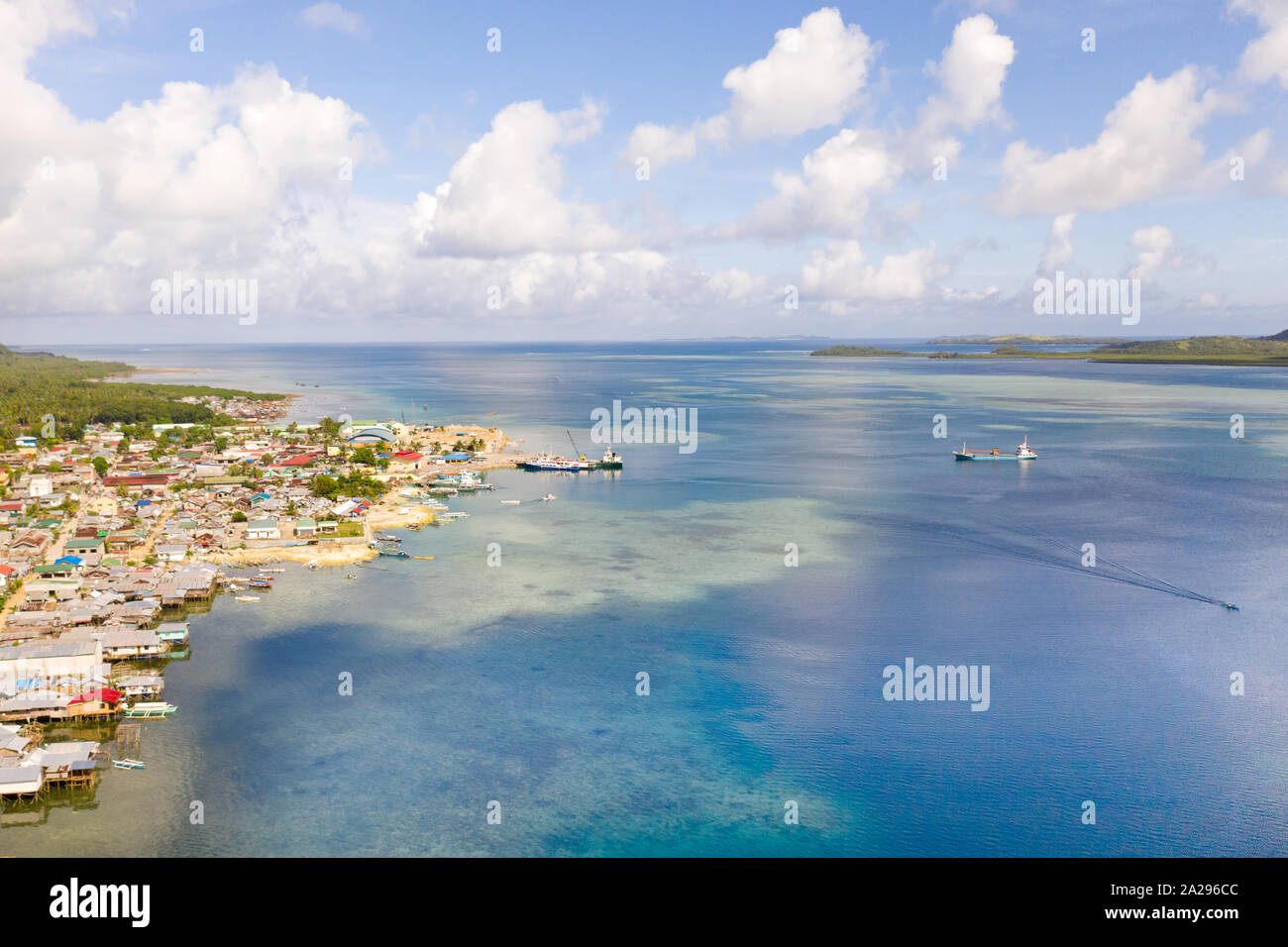 Sea port in the city of Dapa, Philippines. Fishing village and ships ...