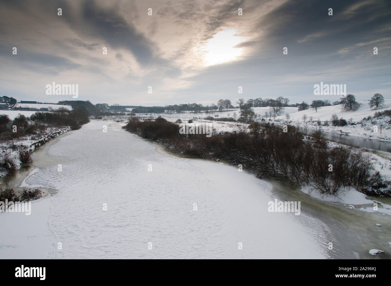 The River Tweed frozen over looking up river from Ladykirk and Norham ...
