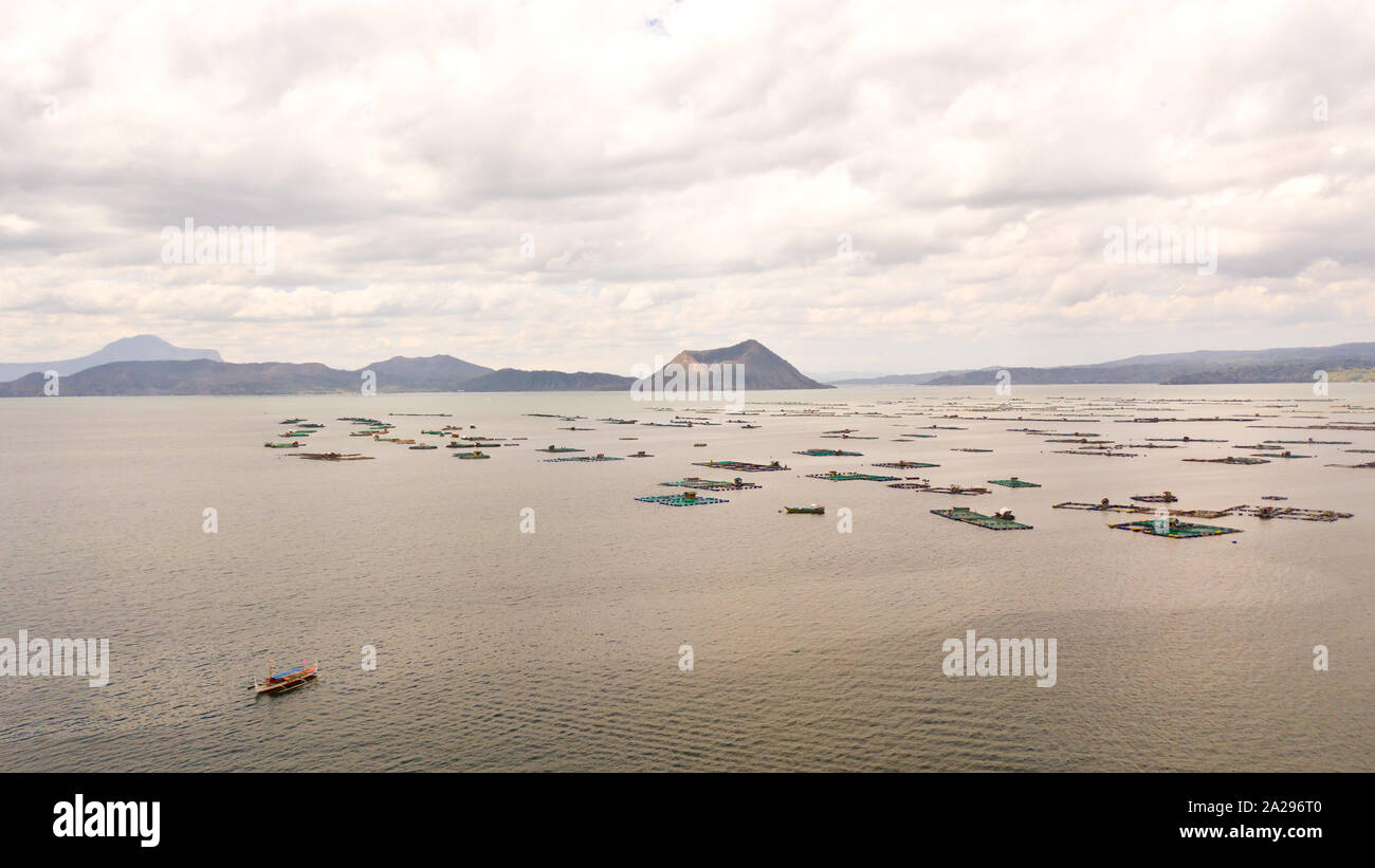 Lake Taal with a volcano and fish cages on a fish farm, top view. Luzon ...
