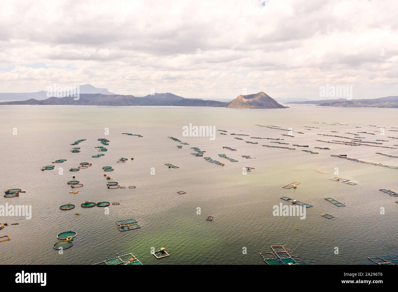Lake Taal with a volcano and fish cages on a fish farm, top view. Luzon ...