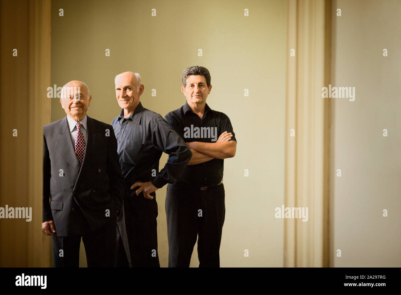 View of three men posing at the camera Stock Photo - Alamy
