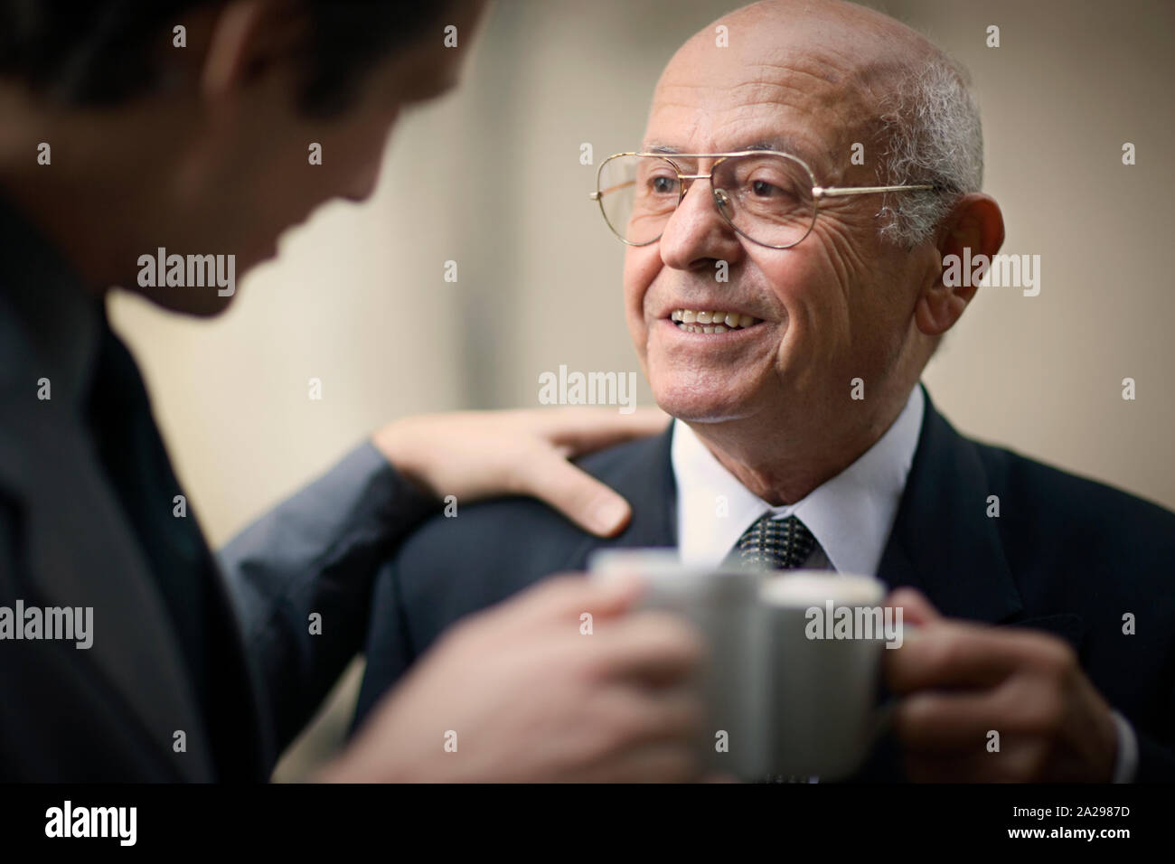 View of two men in a conversation Stock Photo - Alamy