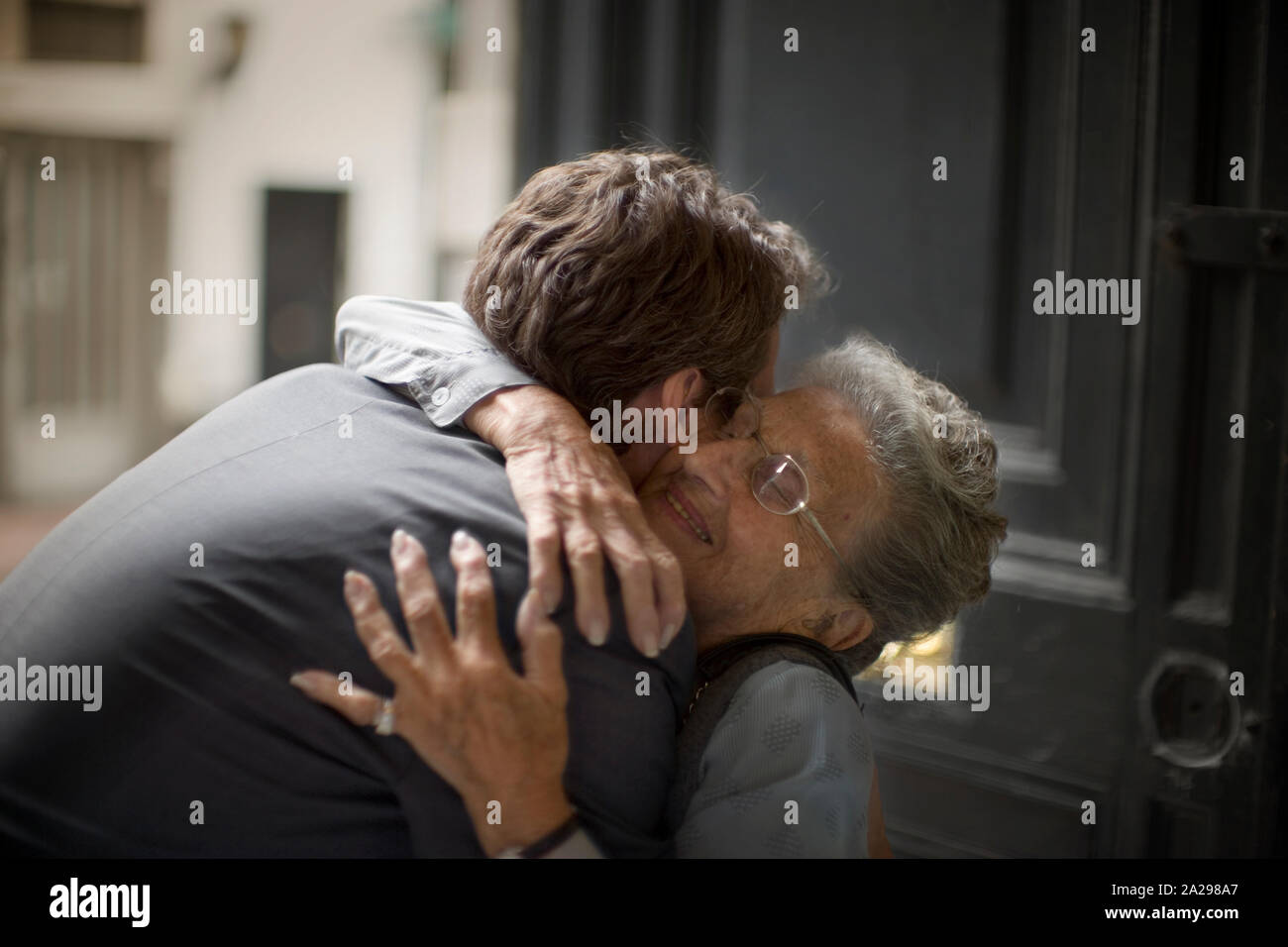 View of an elderly lady hugging her son Stock Photo - Alamy