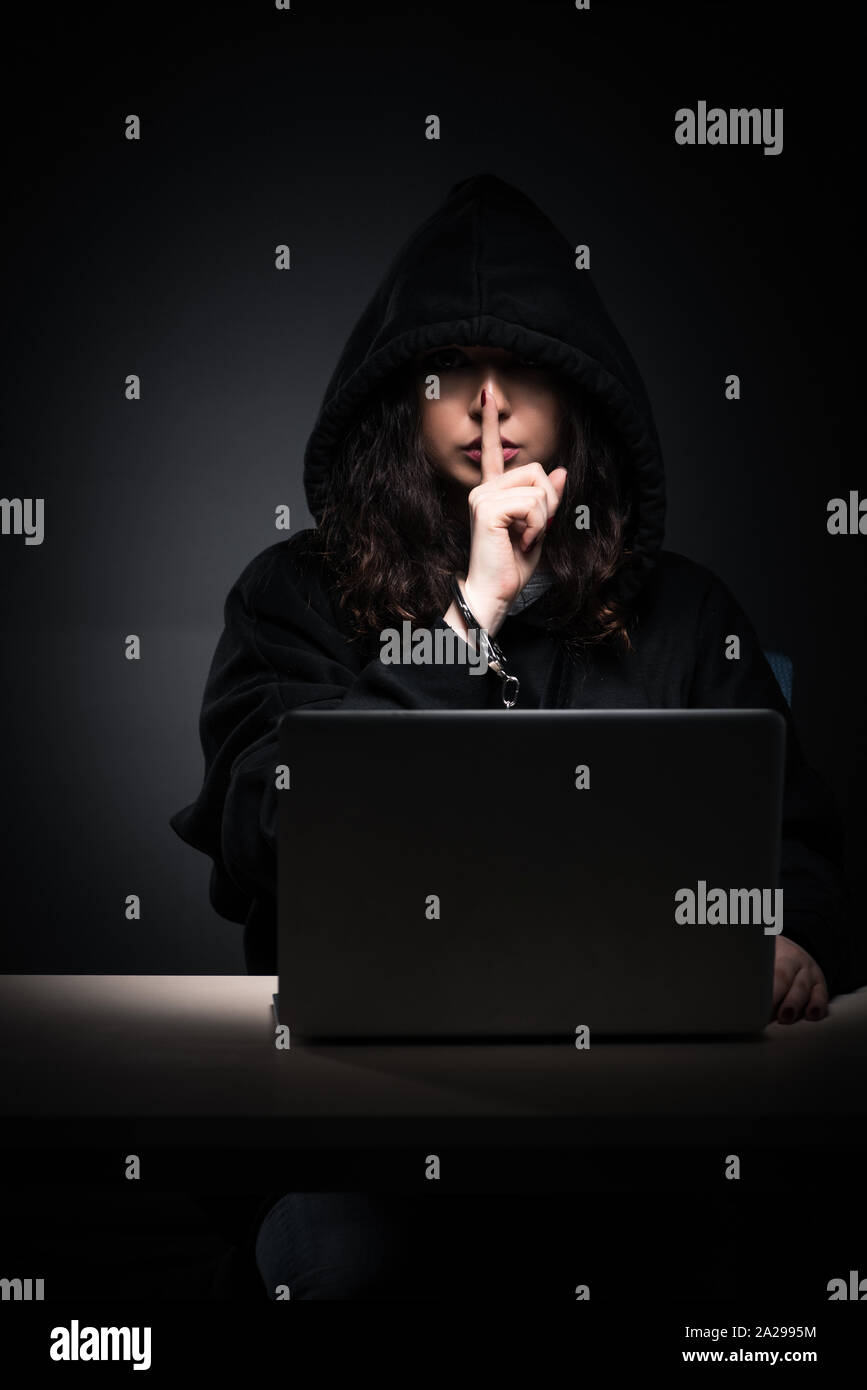 The female hacker hacking security firewall late in office Stock Photo ...