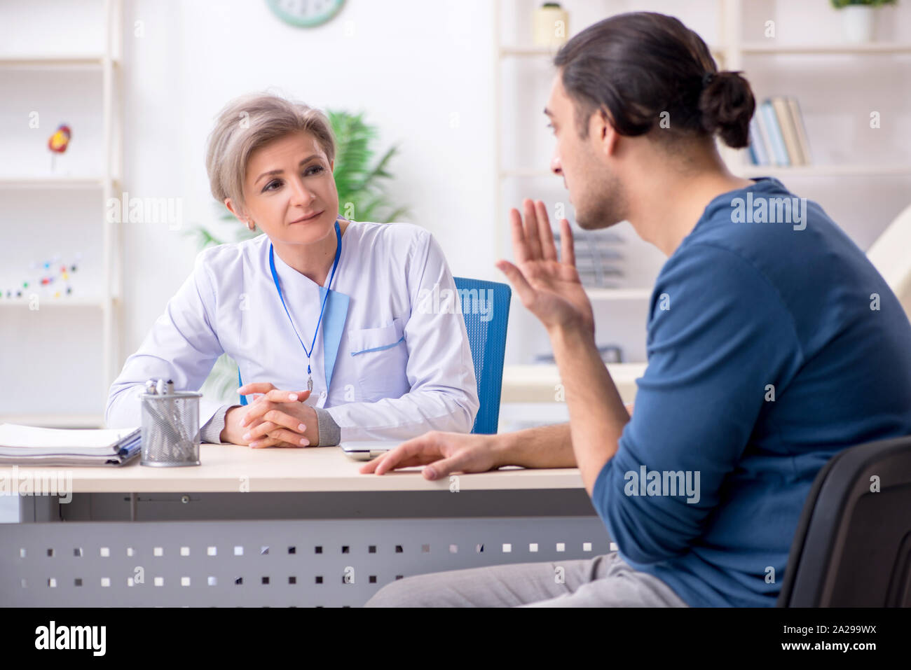 The young patient visiting doctor in hospital Stock Photo - Alamy