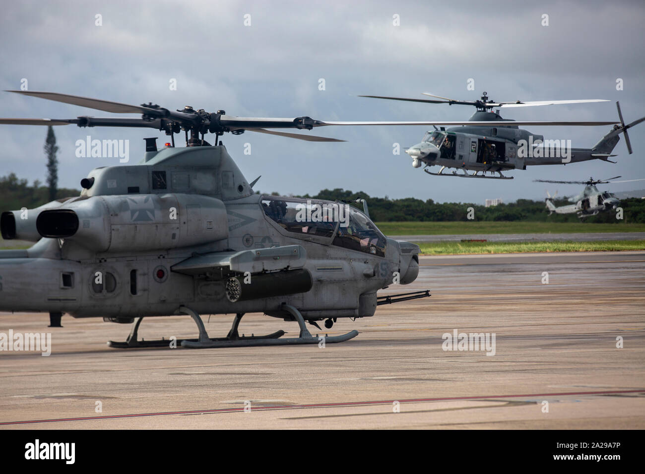 An AH-1Z Cobras and two UH-1Y helicopters with Marine Light Attack ...