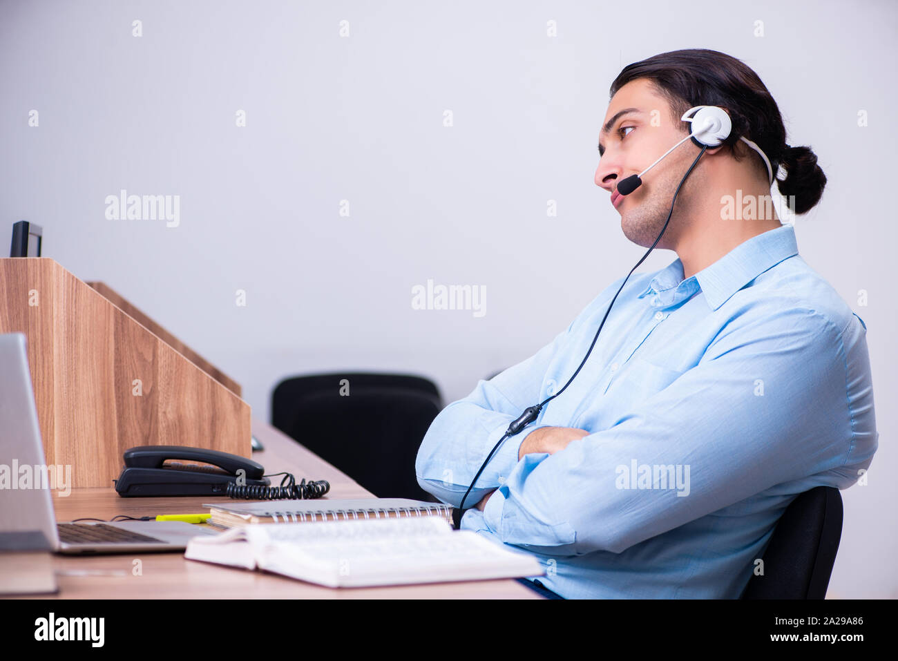 The call center operator working at his desk Stock Photo - Alamy