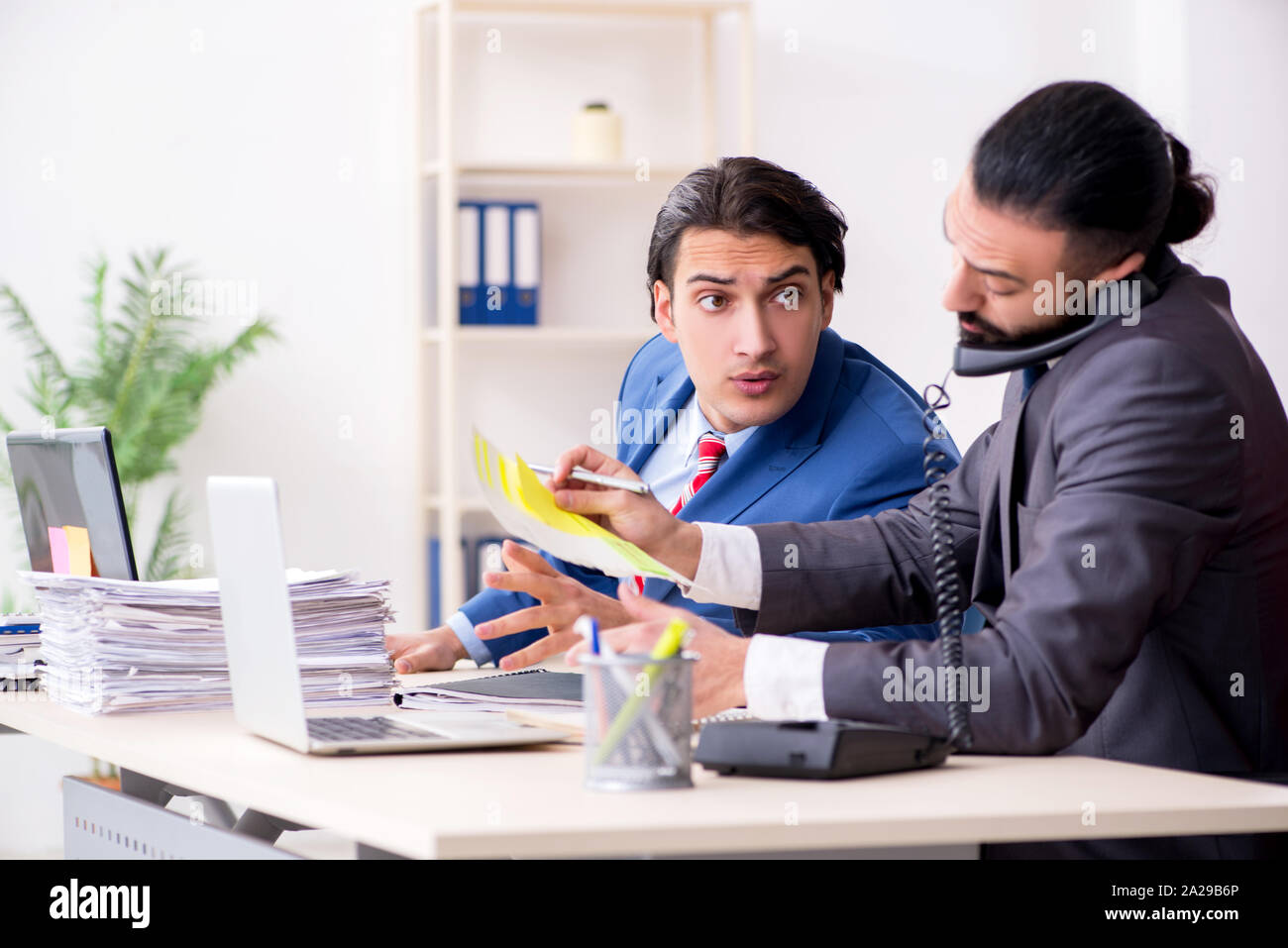 The two male colleagues in the office Stock Photo - Alamy
