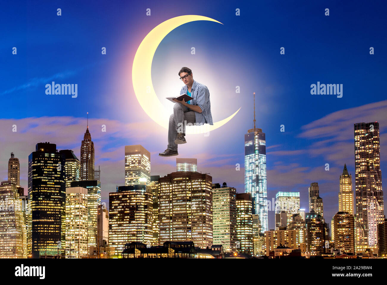 The student reading book on the moon crescent Stock Photo - Alamy