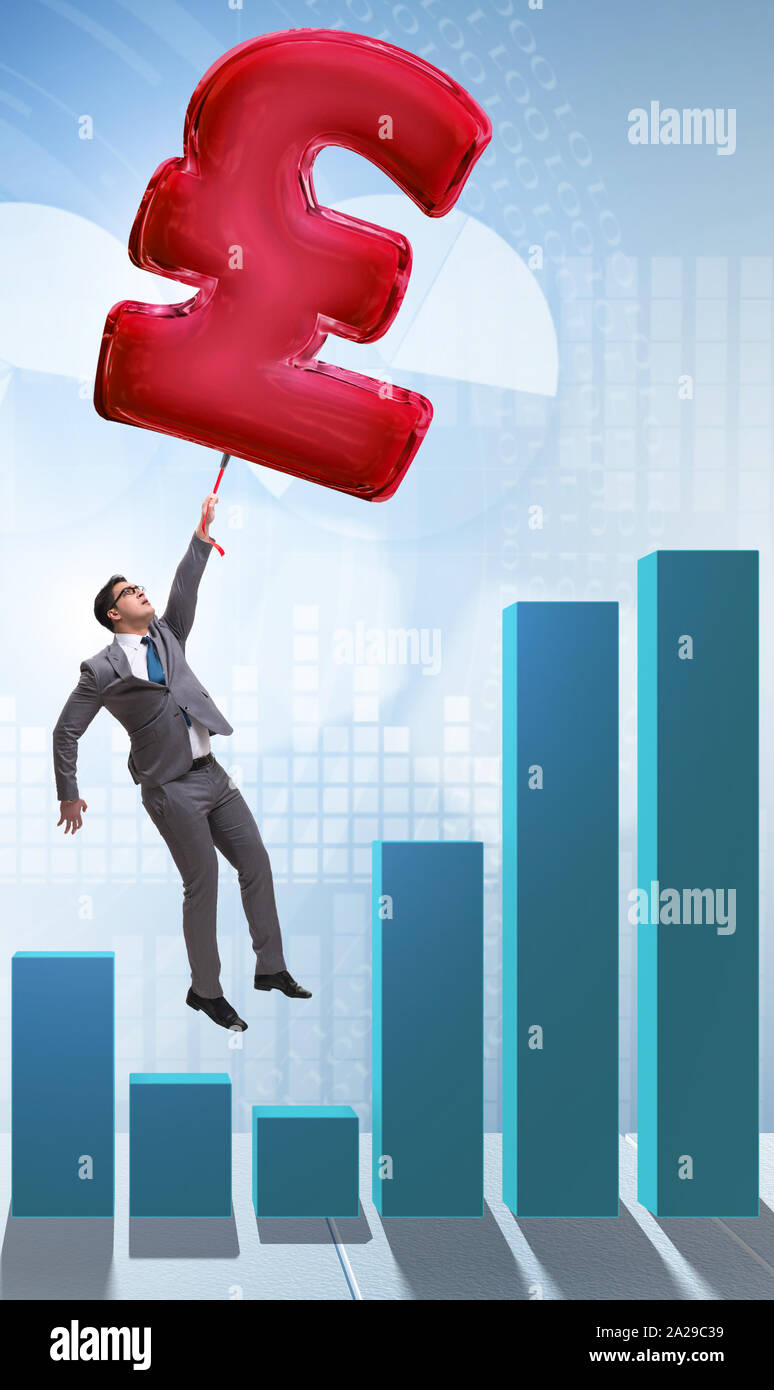 The businessman flying on british pound sign inflatable balloon Stock ...