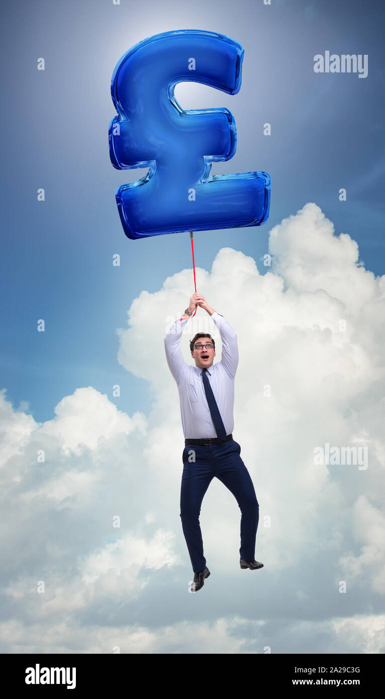 The businessman flying on british pound sign inflatable balloon Stock ...