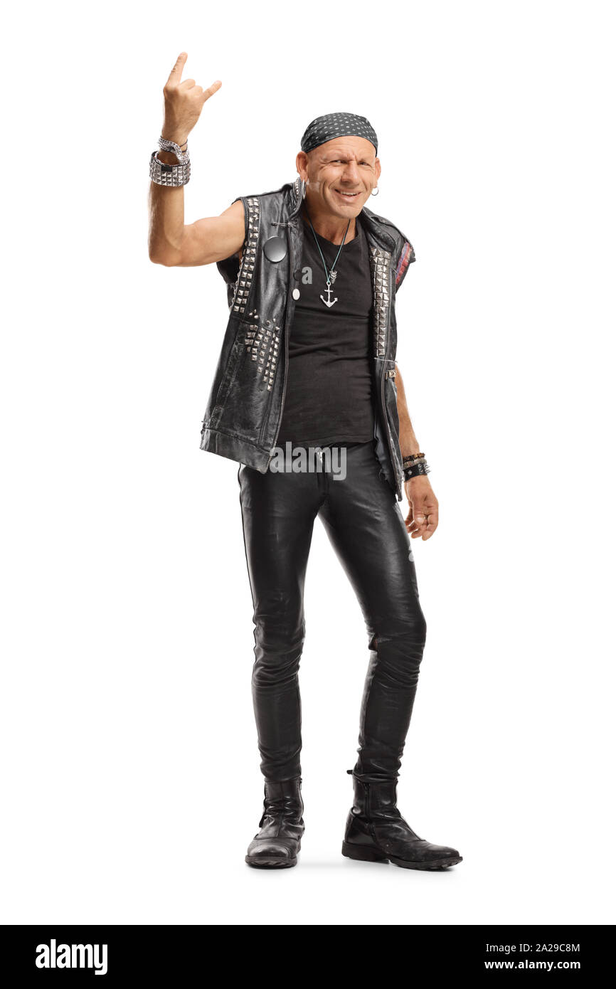 Full length portrait of a punker with a headscarf showing horn sign ...