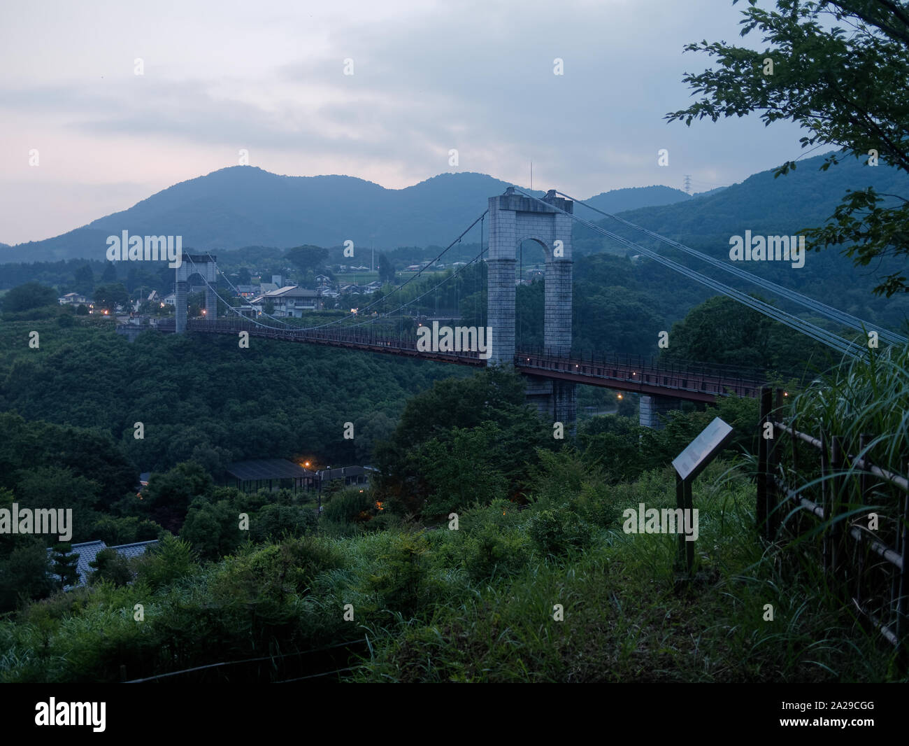 Suspension bridge in the forest at dusk. Photographed at Hadano Togawa ...